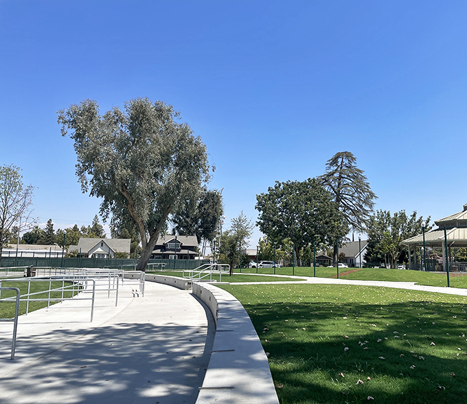 These peaceful park paths wind through a community where neighbors still wave hello daily.