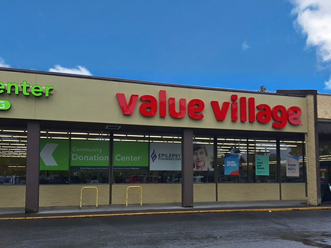 The unmistakable red "value village" sign promises affordable treasures within. Where $25 can fill a cart with second-hand gold.