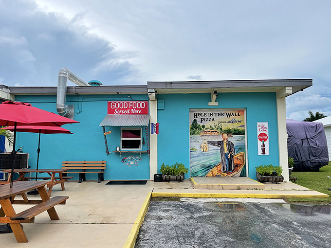 Those cheerful red-checkered tables promise a slice of normalcy—until you remember there might be snakes involved!