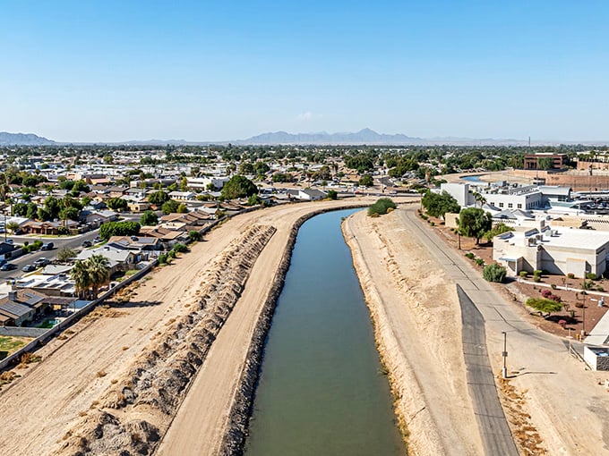 The Colorado River cuts through Yuma like nature's own air conditioner, offering free entertainment and cooling desert breezes.