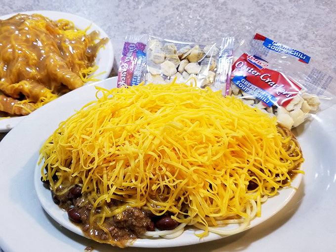 Behold the legendary 3-Way: spaghetti, chili, and a mountain of finely shredded cheddar that would make a snowplow operator nervous.