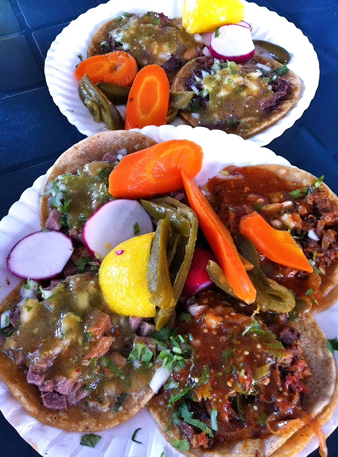 Taco perfection doesn't need fancy plating. These street-style beauties come loaded with meat, fresh toppings, and those essential lime wedges and radishes.