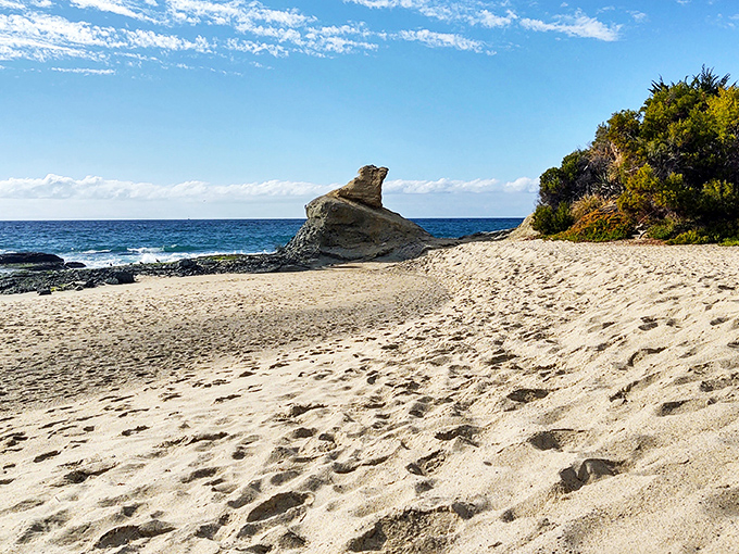 At Aliso Beach, that distinctive rock formation isn't just nature's sculpture&mdash;it's been photobombing family vacation pictures for generations.