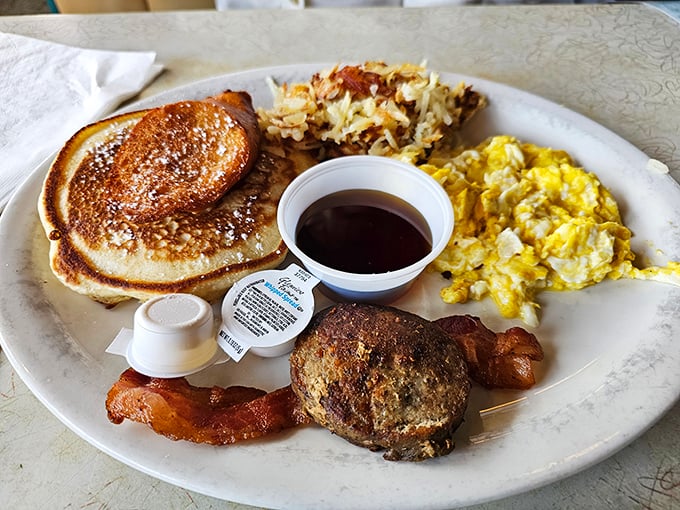 Breakfast perfection isn't complicated – just a golden pancake, properly scrambled eggs, crispy hash browns, and bacon that snaps just right between your teeth.