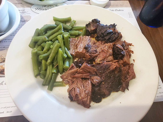Behold the star attraction&mdash;roast beef so tender it practically surrenders to your fork, paired with green beans that actually taste like vegetables should.