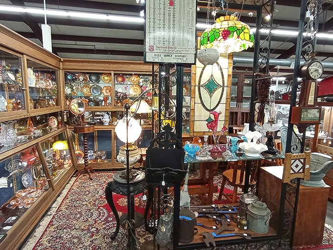 Stained glass meets vintage charm in this dealer's corner. That Tiffany-style lamp would make even the dullest living room feel like a Jazz Age speakeasy.