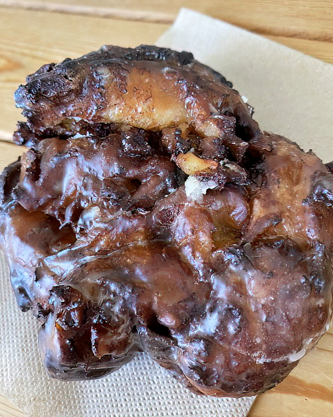 The apple fritter: a craggy, caramelized landscape of apple-studded dough that makes geologists and pastry lovers equally weak-kneed.