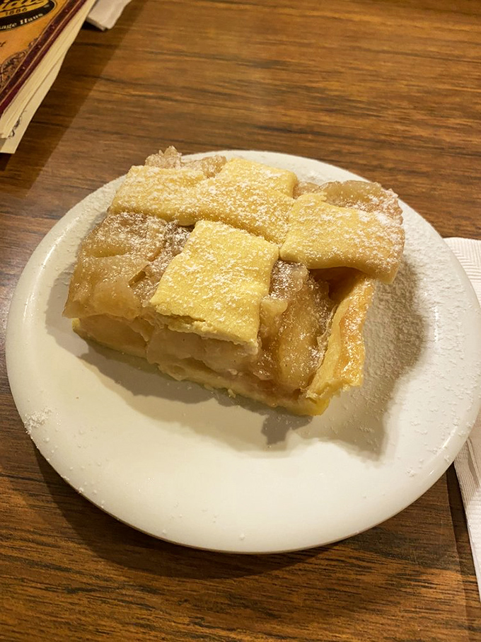 Apple strudel that shatters into a thousand delicious shards—proof that the best things in life come dusted with powdered sugar.