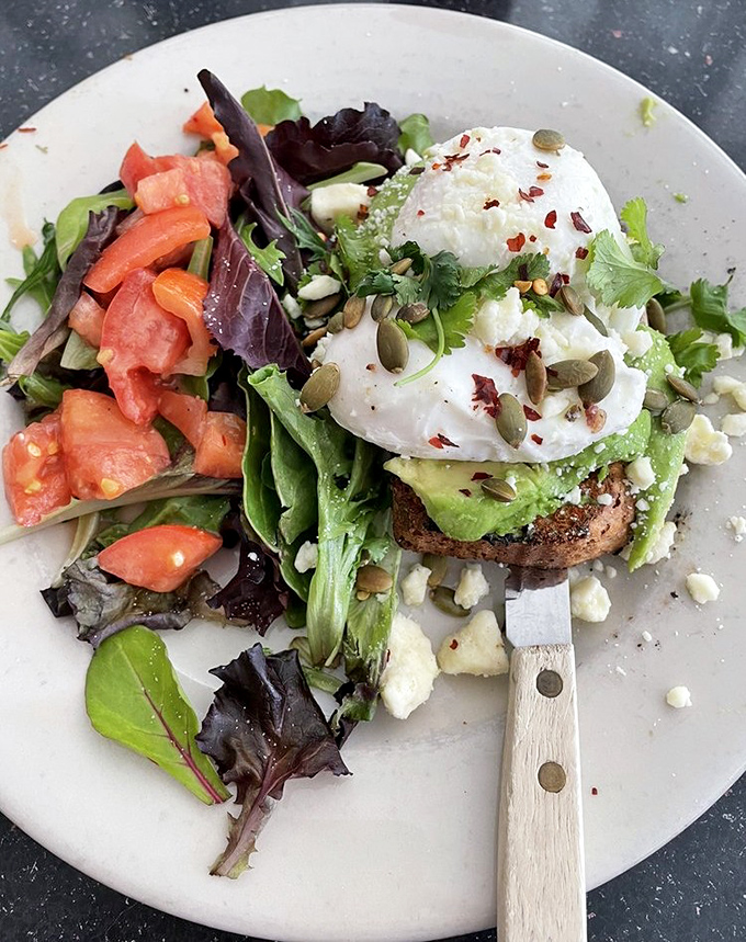 Avocado toast elevated to an art form. That perfectly poached egg waits to cascade golden goodness over creamy avocado and hearty sourdough&mdash;a breakfast worthy of your Instagram and your appetite.