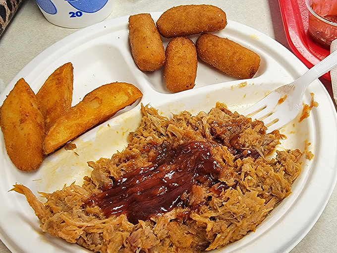 Pulled pork perfection with that signature sauce &ndash; this is the plate that launches hundred-mile road trips and family traditions.