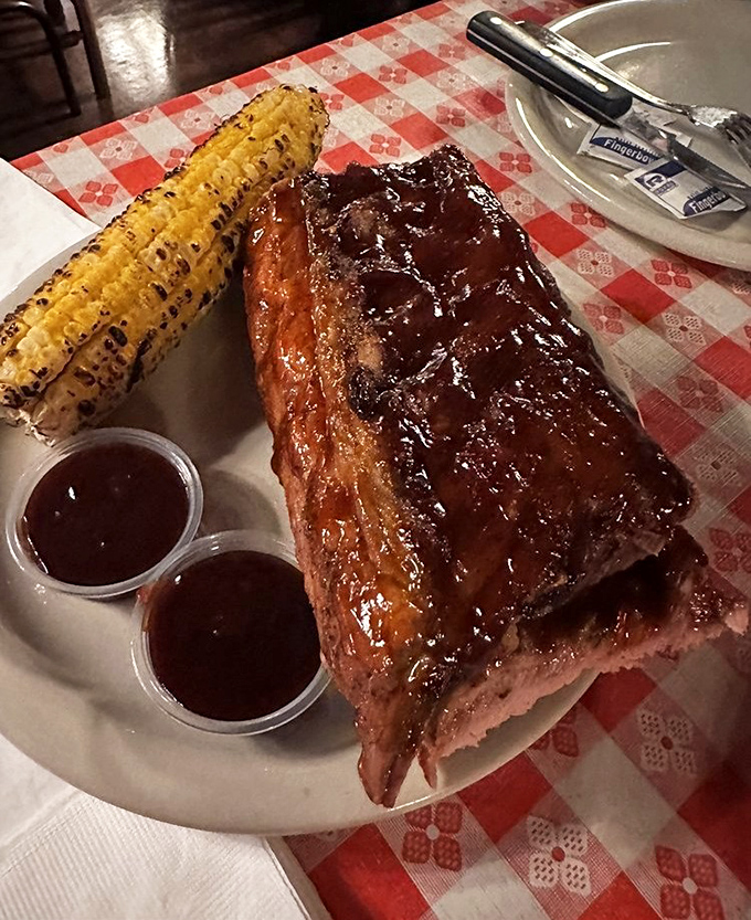 Barbecue ribs glistening with sauce that would make a vegetarian reconsider life choices. Paired with grilled corn, this is Arizona comfort on a plate.