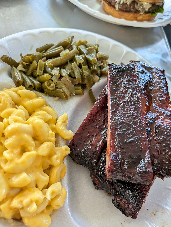 These ribs don't just fall off the bone &ndash; they practically leap onto your fork. Paired with creamy mac and cheese and green beans, it's comfort food elevated to art.