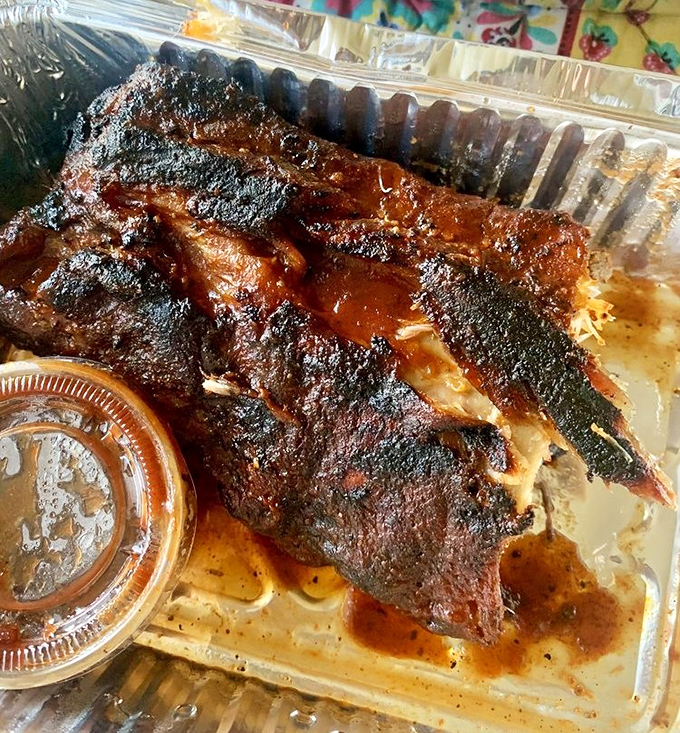 These ribs glisten like edible mahogany, achieving that perfect bark that separates the masters from the amateurs.