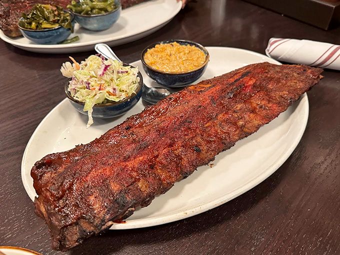 These ribs don't just fall off the bone—they perform a graceful swan dive with Olympic-level precision. The bark alone deserves its own medal ceremony.