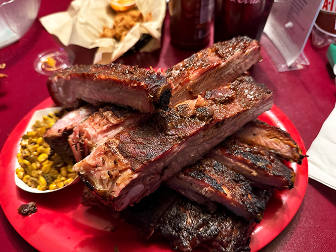 Behold the star of the show&mdash;ribs with that perfect pink smoke ring and beautiful bark. This isn't just dinner; it's edible architecture built by patient pit masters.