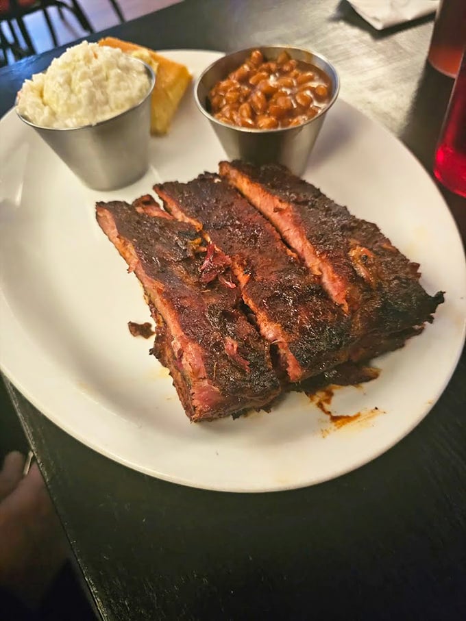 Behold the holy trinity of barbecue &ndash; perfectly barked ribs, creamy mac and cheese, and beans that have clearly been introduced to their meaty cousins.