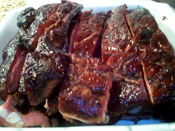 These ribs aren't just cooked&mdash;they're transformed. That bark, that smoke ring, that glistening surface... poetry on a plate.