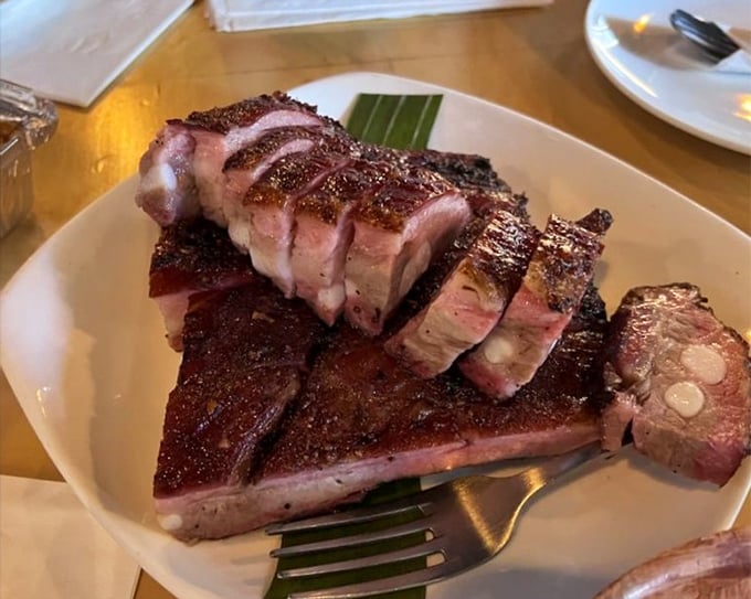 Behold the star of the show: ribs with a bark so perfect it deserves its own Grammy. The pink smoke ring is BBQ's equivalent of a Rolex&mdash;pure status.
