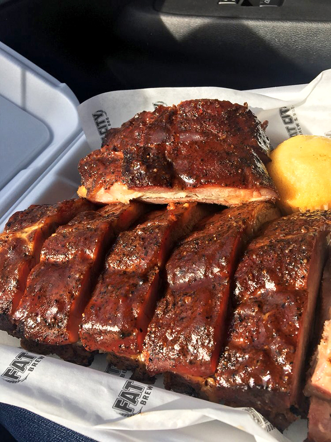 Behold the star attraction: ribs with that perfect mahogany bark. The kind of BBQ that makes you temporarily forget table manners exist.