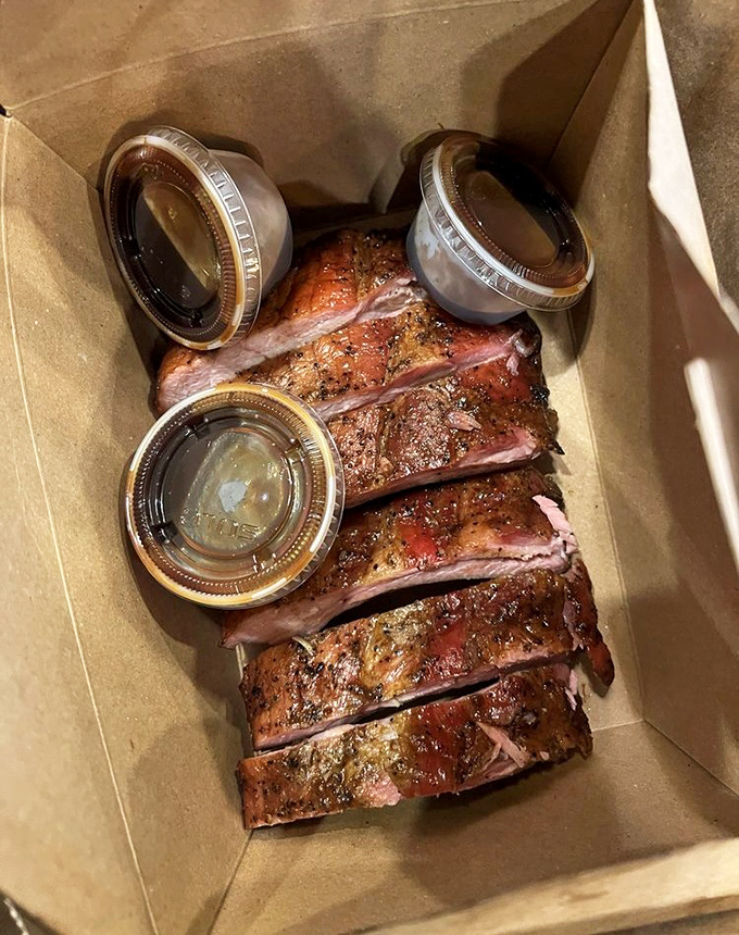 These ribs don't just fall off the bone&mdash;they practically leap into your mouth. The perfect pink smoke ring and spice-crusted exterior tell you someone's been paying attention.