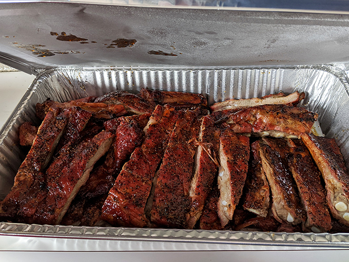 These ribs aren't just smoked&mdash;they're transformed into glistening monuments to patience, with a bark so perfect it deserves its own appreciation society.