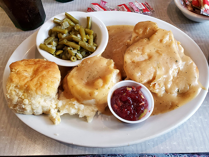 Behold: the turkey and gravy that launched a thousand food comas. That biscuit isn't just a side&mdash;it's the co-star of this comfort food show.