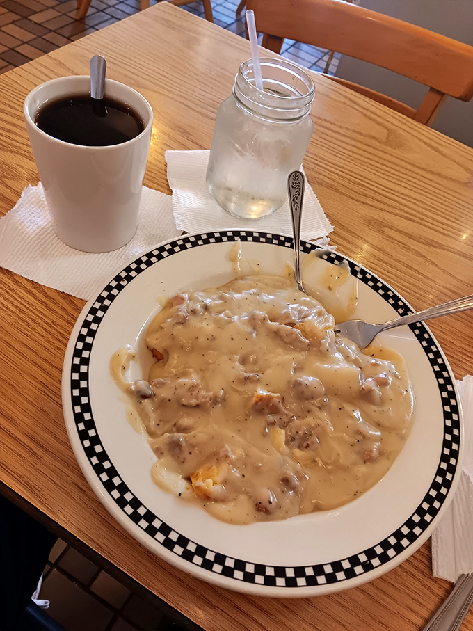 Behold the star attraction: biscuits and gravy that could make a cardiologist weep with both professional concern and personal delight.
