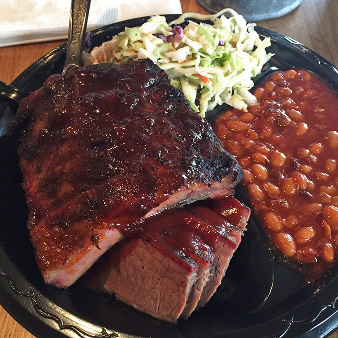 Behold the ribs—where the bark is as impressive as the bite. That pink smoke ring is nature's way of saying "you're welcome."