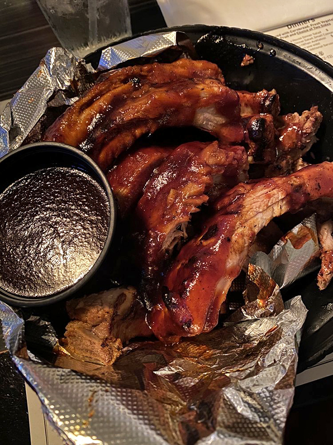 These baby back ribs aren't just falling off the bone&mdash;they're practically volunteering to jump onto your fork. The sauce cup is merely a formality.