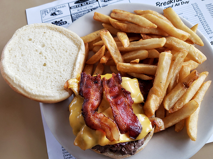 This isn't just a bacon cheeseburger; it's edible poetry with crispy bacon sonnets and melty cheese verses.