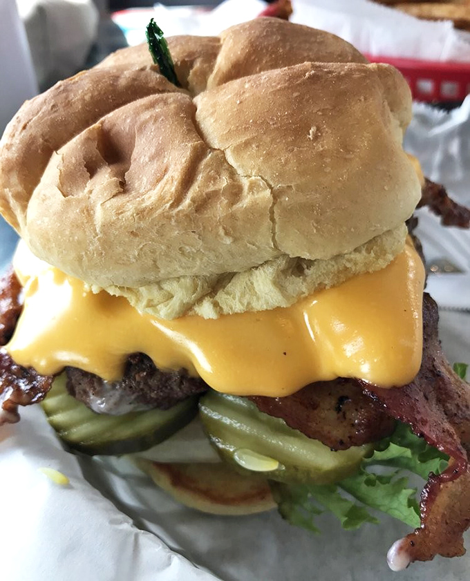 This isn't just a bacon cheeseburger&mdash;it's edible architecture. Melted cheese cascades down the sides like a yellow waterfall of happiness.