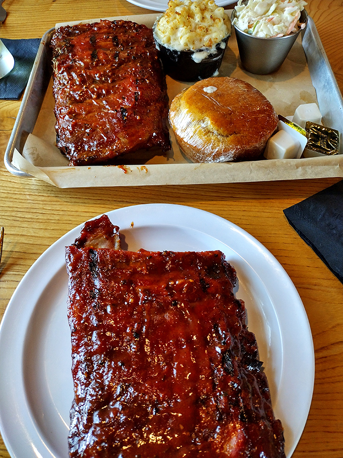 These ribs aren't just cooked; they're coaxed into perfection. The glaze catches light like stained glass in a cathedral of smoke.