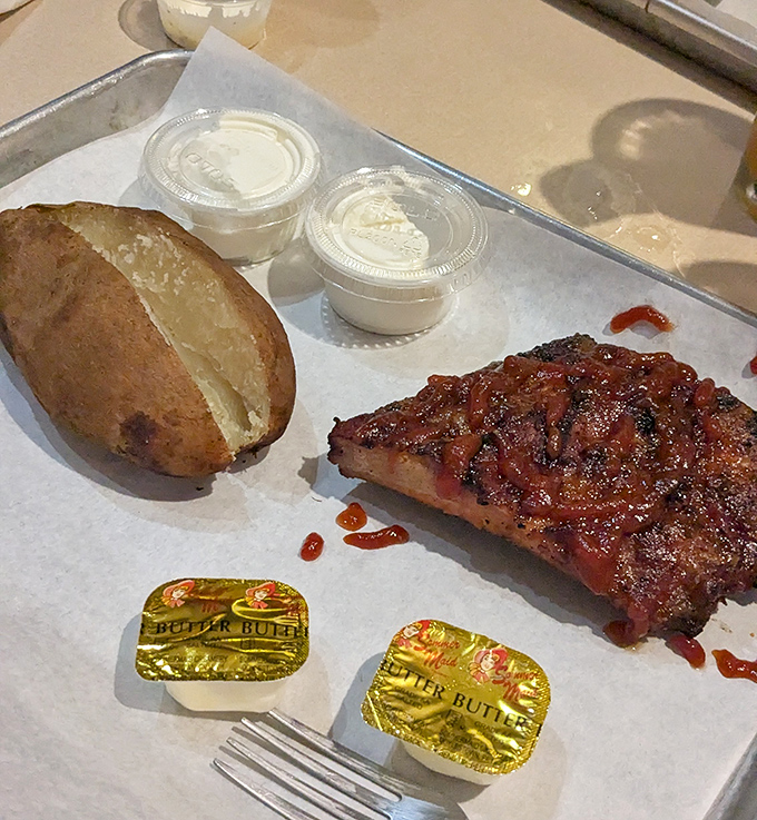 Brisket and potato perfection on a tray. That bark, that smoke ring&mdash;it's the kind of meat that makes vegetarians question their life choices.