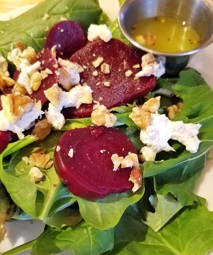Behold the star attraction &ndash; roasted beets nestled among fresh greens, crowned with goat cheese and walnuts. Vegetable royalty, no scepter required.