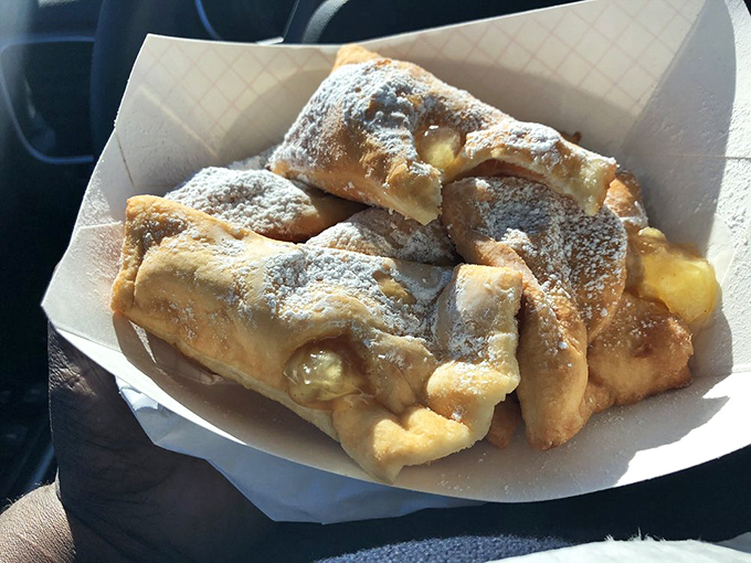Behold the star attraction: golden-fried beignets dusted with a snowstorm of powdered sugar. Worth every napkin you'll need afterward.