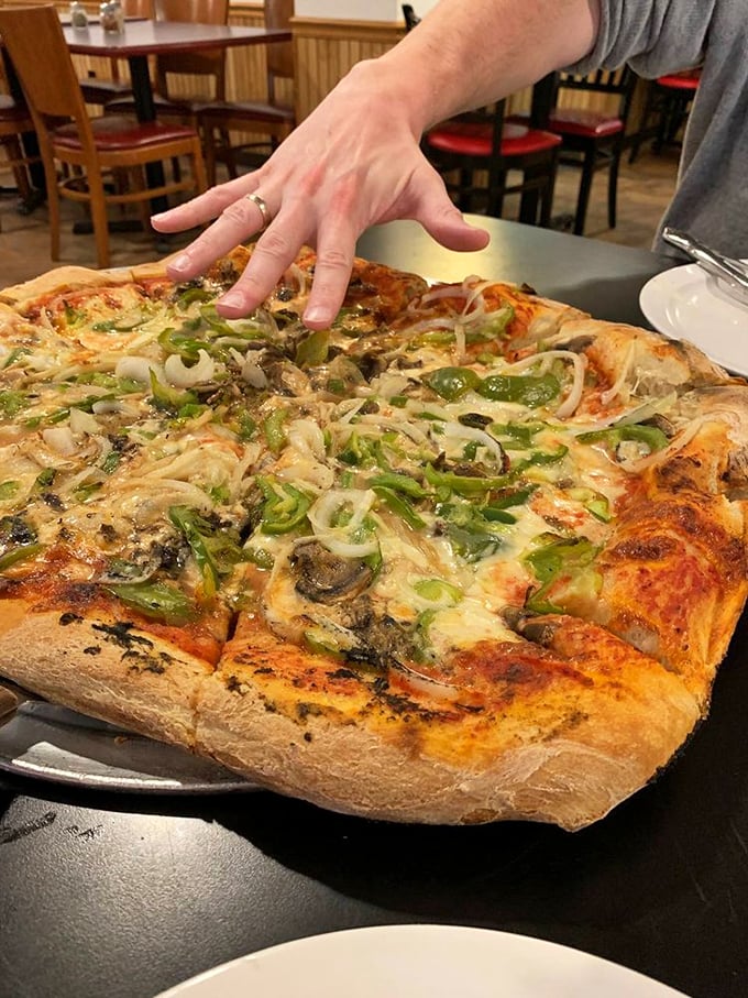 This isn't just pizza—it's an architectural marvel of cheese, veggies, and perfectly bubbled crust that demands to be photographed before devoured.