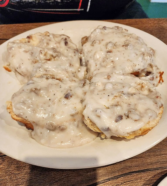 These biscuits and gravy aren't just breakfast; they're an edible Southern history lesson that speaks in the universal language of comfort.