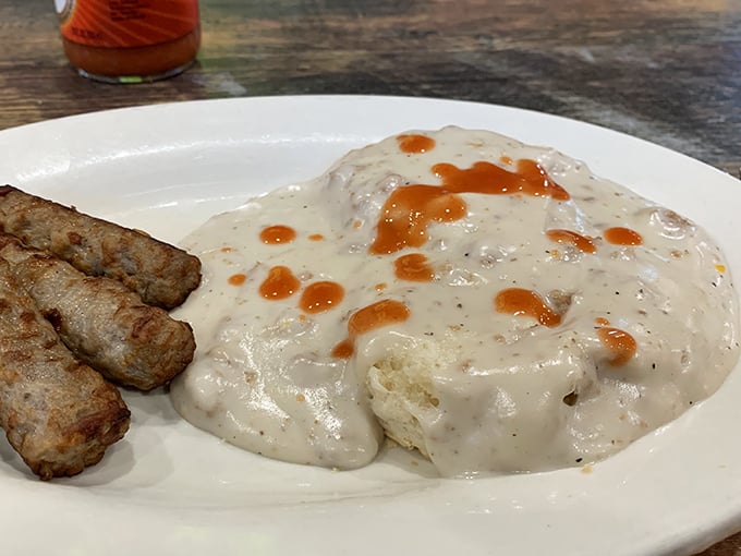 Biscuits and gravy that could make a grown Midwesterner weep with joy. That hot sauce drizzle? Pure genius.