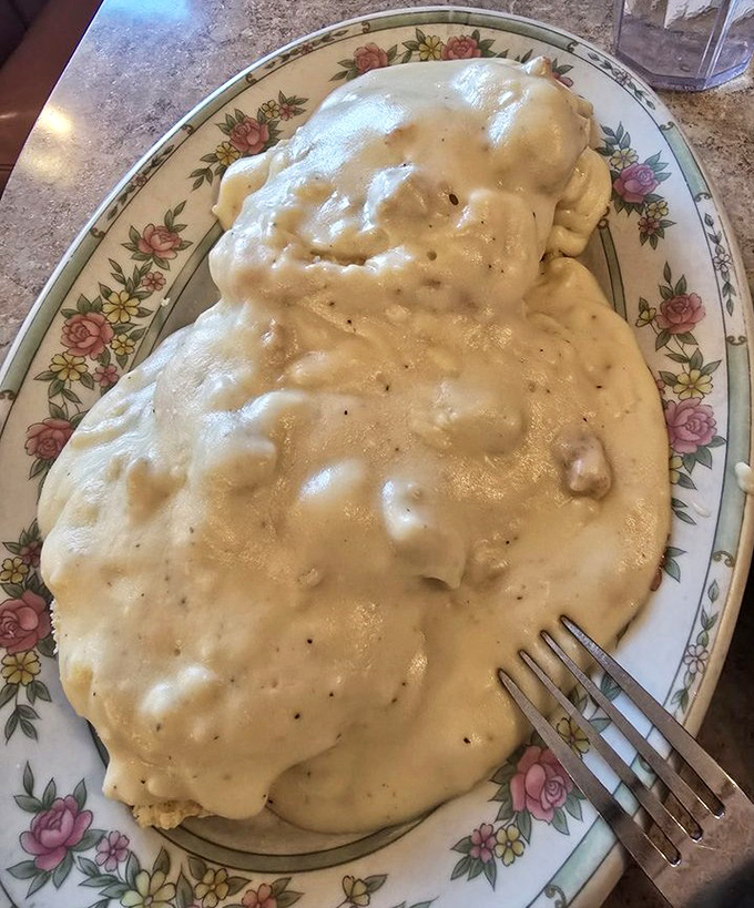 Behold: the holy grail of diner cuisine. This plate of biscuits and gravy isn't just breakfast&mdash;it's an edible hug.