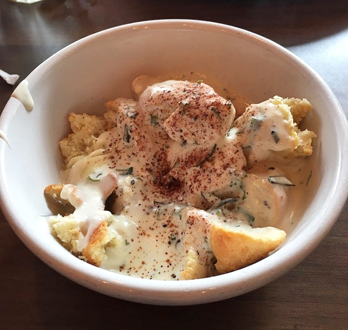 Behold the star attraction: biscuits and gravy that could make a Southern grandmother nod in solemn approval.