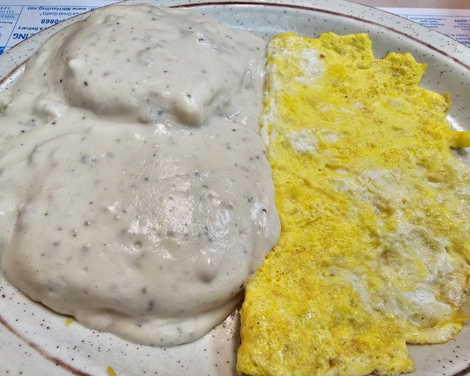 Behold the marriage of fluffy omelet and country gravy - a relationship more perfect than most Hollywood romances. Breakfast nirvana achieved.