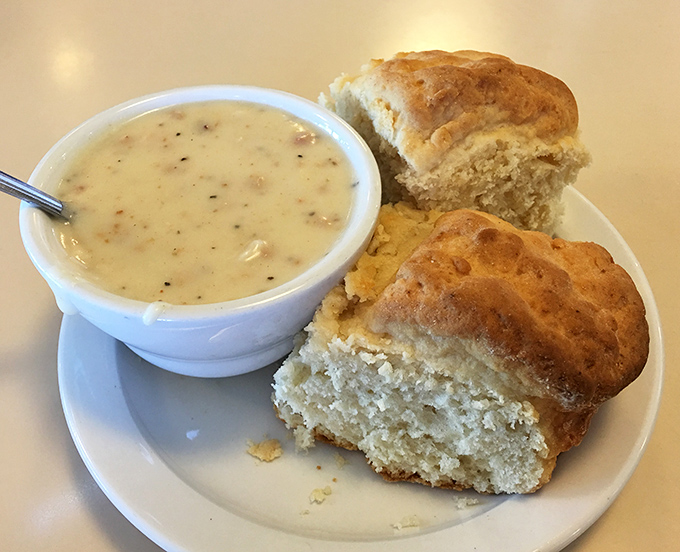 Behold the holy grail of comfort food: fluffy biscuits drowning in creamy, peppery gravy perfection.