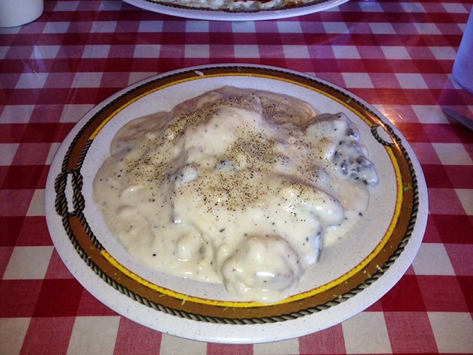 This is what breakfast dreams are made of &ndash; fluffy biscuits drowning in peppered sausage gravy perfection.