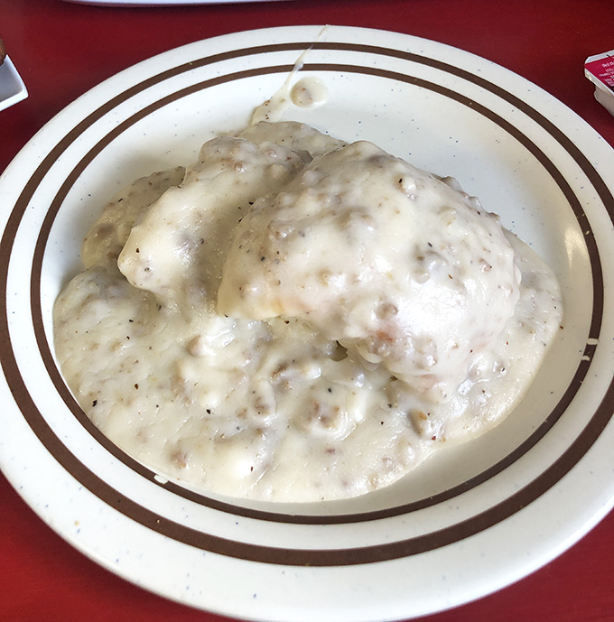 Behold the star attraction: biscuits drowning in a sea of peppery sausage gravy. Not diet food, but definitely worth the extra mile on your morning walk.