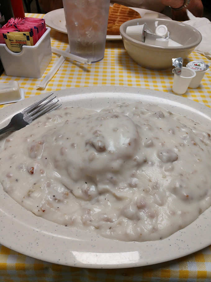 Behold the holy grail of Southern comfort &ndash; biscuits drowning in creamy sausage gravy that would make your cardiologist wince and your soul sing.
