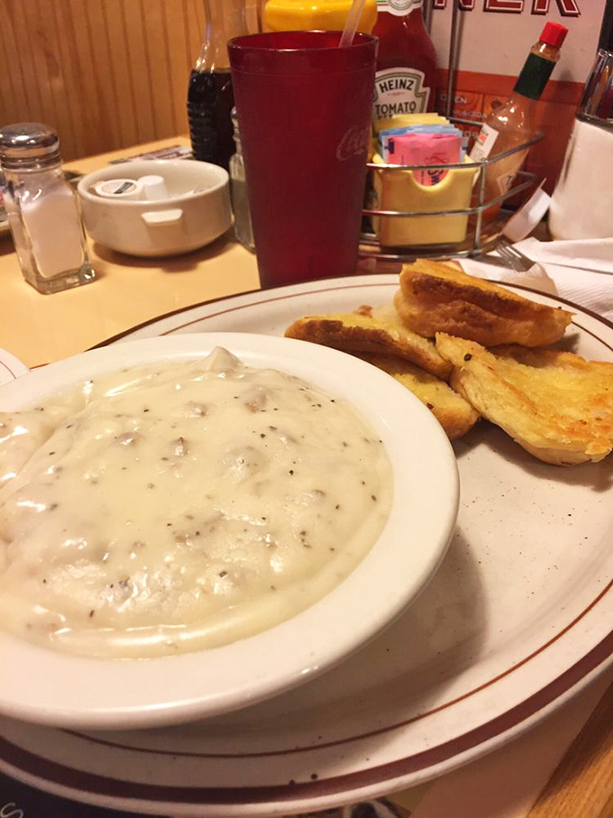 Behold the star attraction - biscuits and gravy so good they should require a permission slip. That pepper-speckled gravy is calling your name.