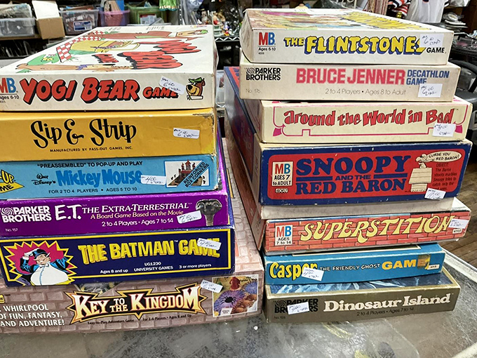 Remember when entertainment didn't require charging? This nostalgic stack of vintage board games proves the Bruce Jenner Decathlon was once family-room famous.