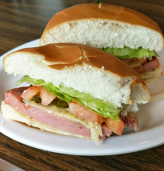 The legendary fried bologna sandwich in all its unpretentious glory. Thick-cut, perfectly grilled, with that signature "bologna bubble" that separates the masters from amateurs.