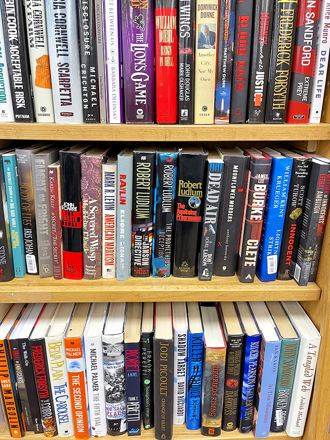 Literary treasures line these shelves, where bestsellers and classics mingle like guests at a particularly well-read cocktail party.