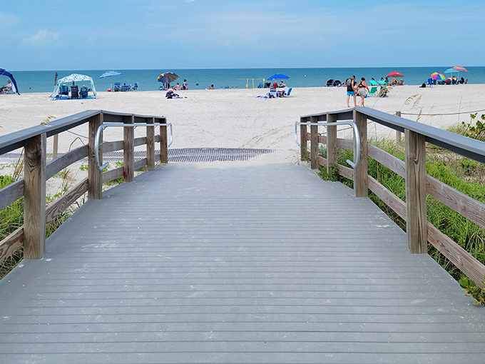 This wooden boardwalk isn't just a path to the beach—it's a runway for your grand entrance to paradise. Cue the vacation soundtrack!